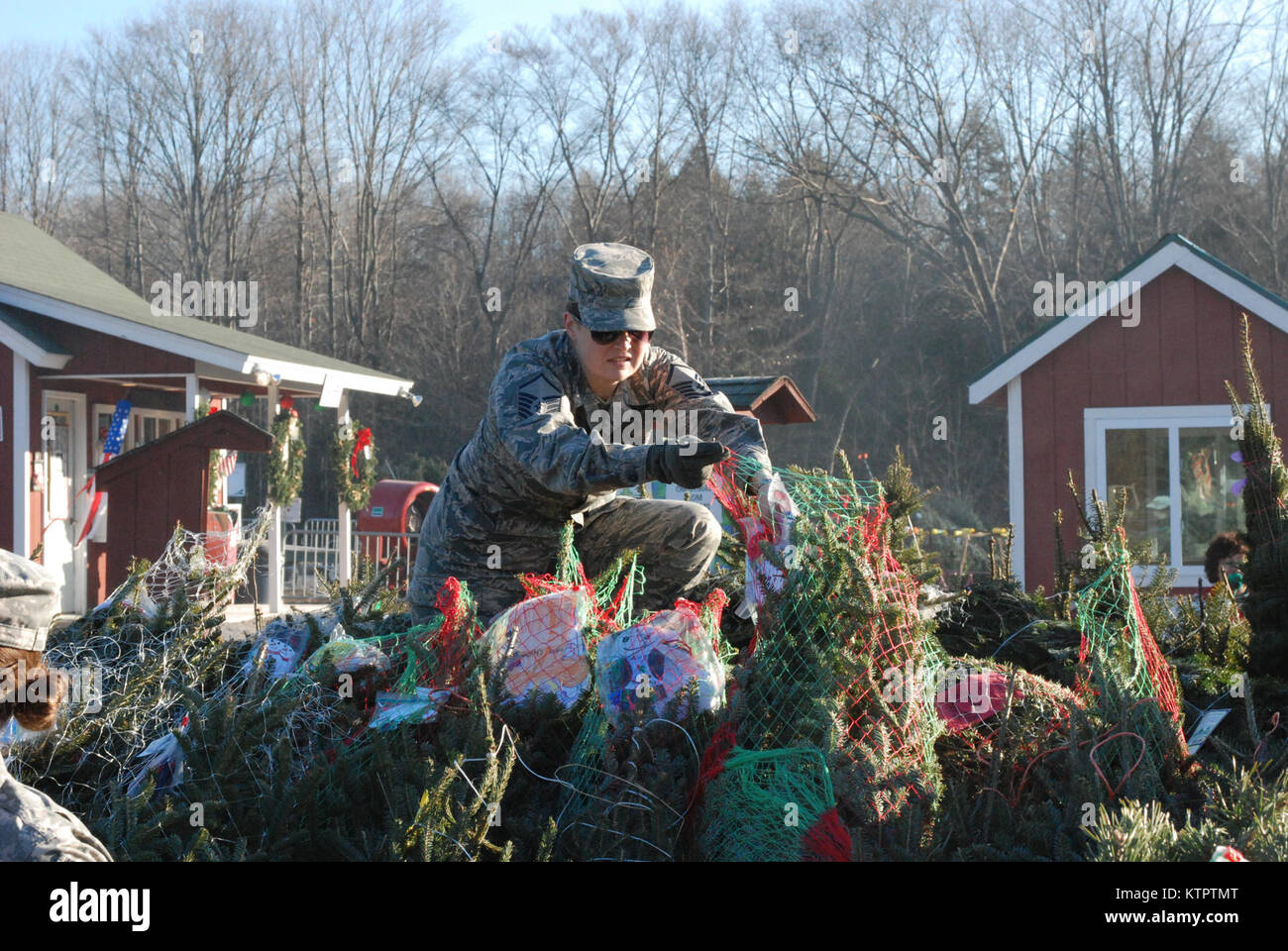 New York Air National Guard Master Sgt. Jennifer Dippo helps load ...