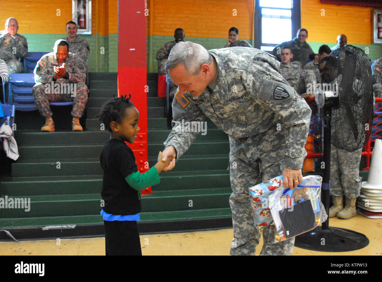 Chief Warrant Officer Gerard Ford, 369th Sustainment Brigade, presents ...