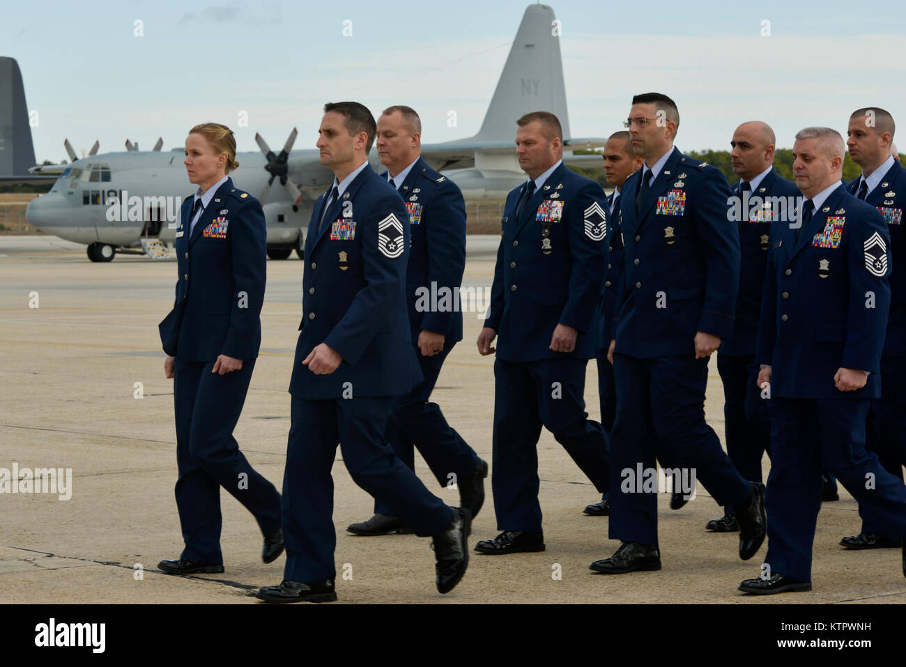 Members of the 105th Airlift Wing and 106th Rescue Wing pay their ...