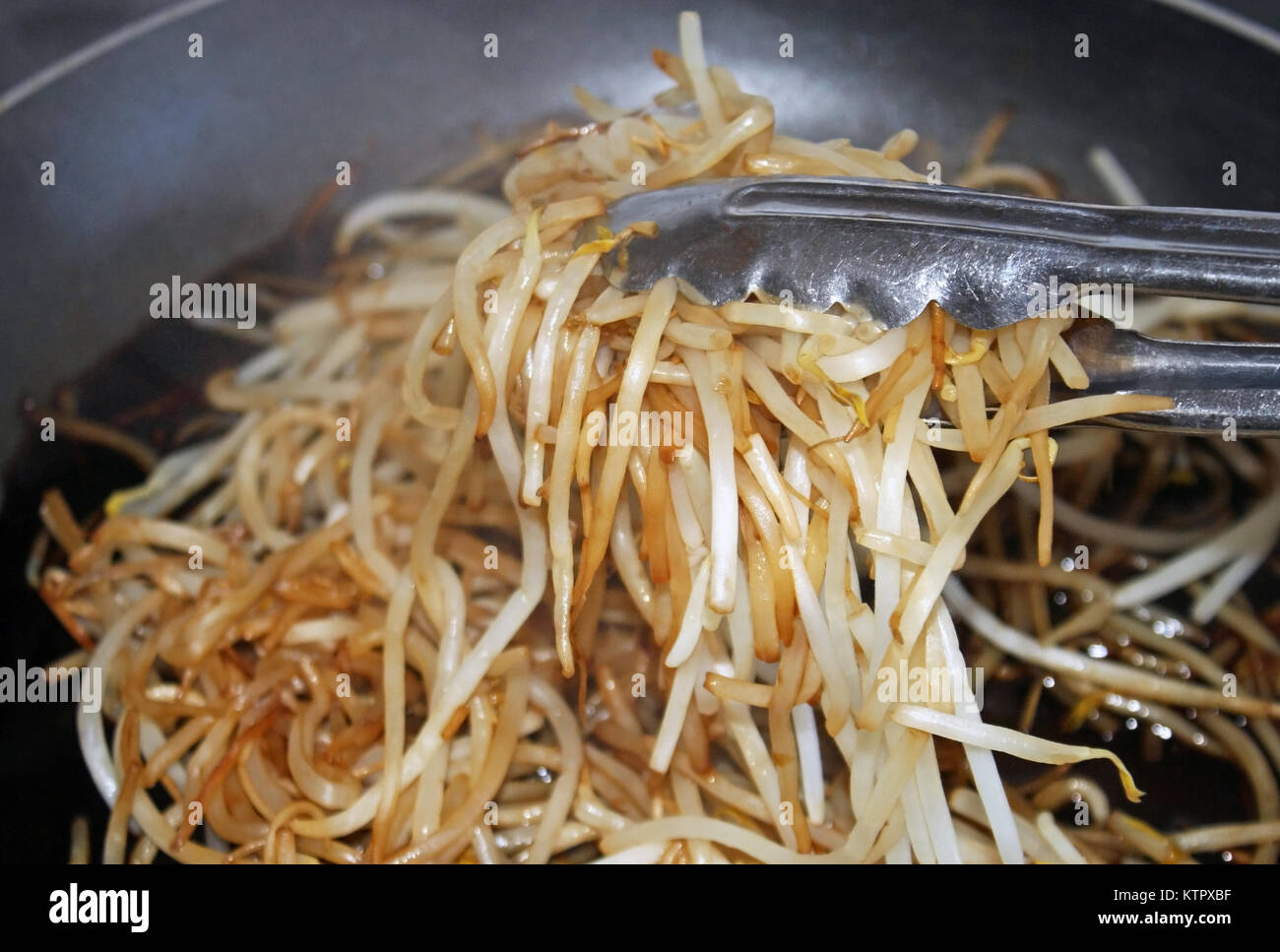 Fresh organic Bean Sprouts cooking in skillet Stock Photo - Alamy