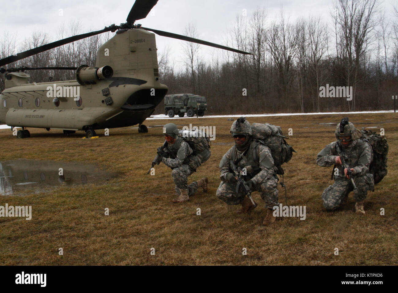 Soldiers of Troop C, 2nd Squadron, 101st Cavalry Regiment exit a CH-47 ...