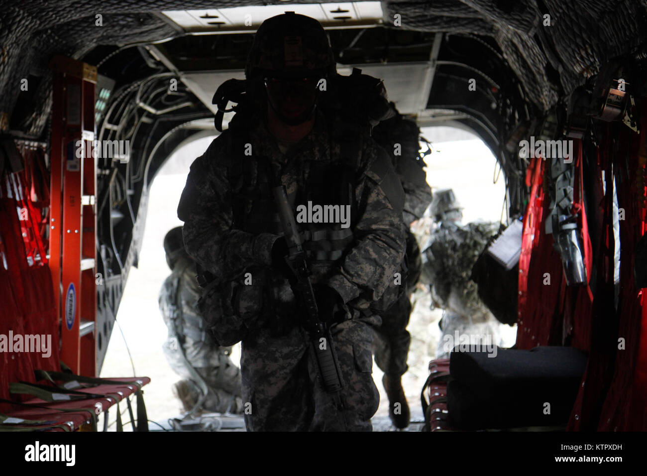 Soldiers of Troop C, 2nd Squadron, 101st Cavalry Regiment exit a CH-47 ...