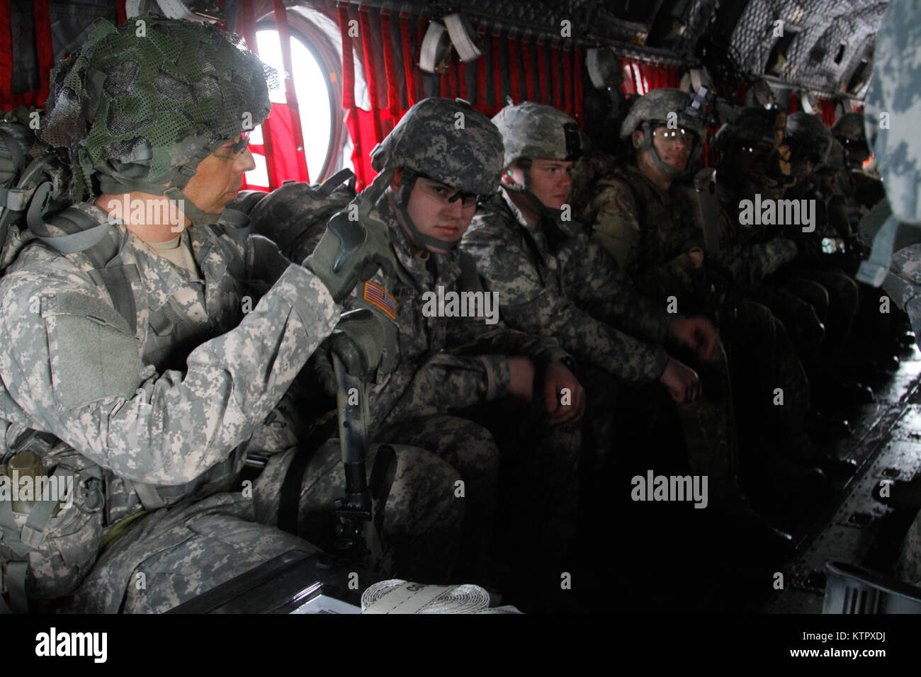 A Soldier from Troop C, 2nd Squadron, 101st Cavalry Regiment signals ...