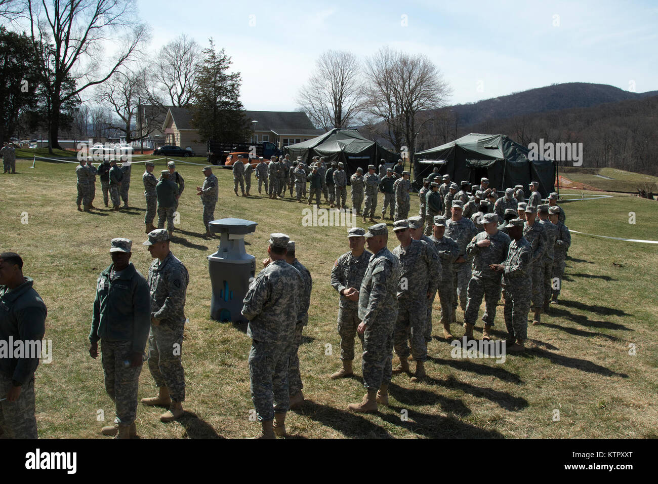 Soldiers from the 369th Sustainment Brigade stand in line to get lunch ...