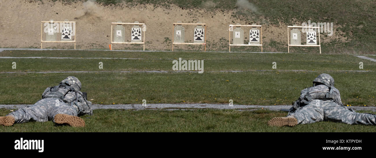 Two Soldiers fire their M16 rifles from the prone supported position ...