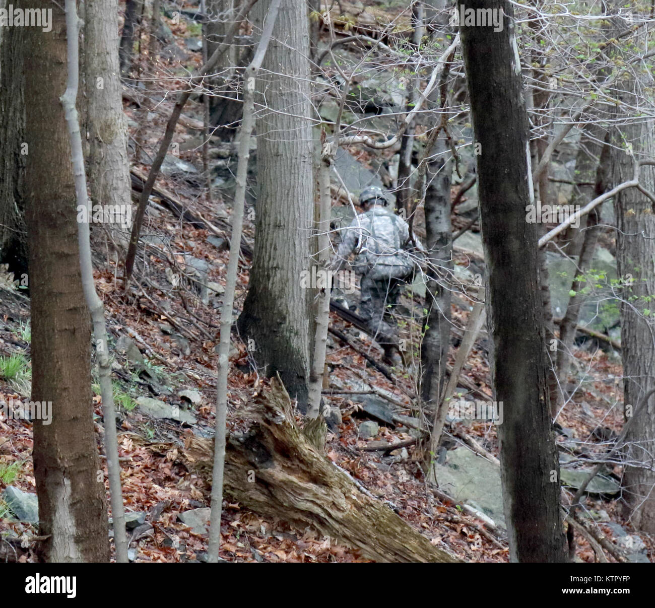 A New York Army National Guard Soldier navigates the rugged terrain ...