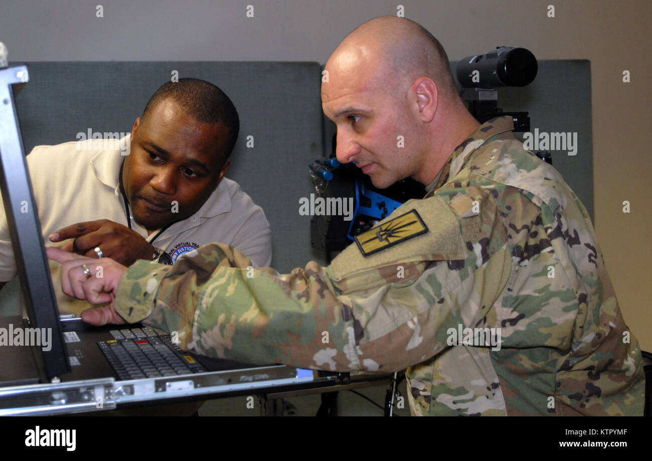 LATHAM, N.Y. -- National Guard contractor Leon Jackson (left) and New ...