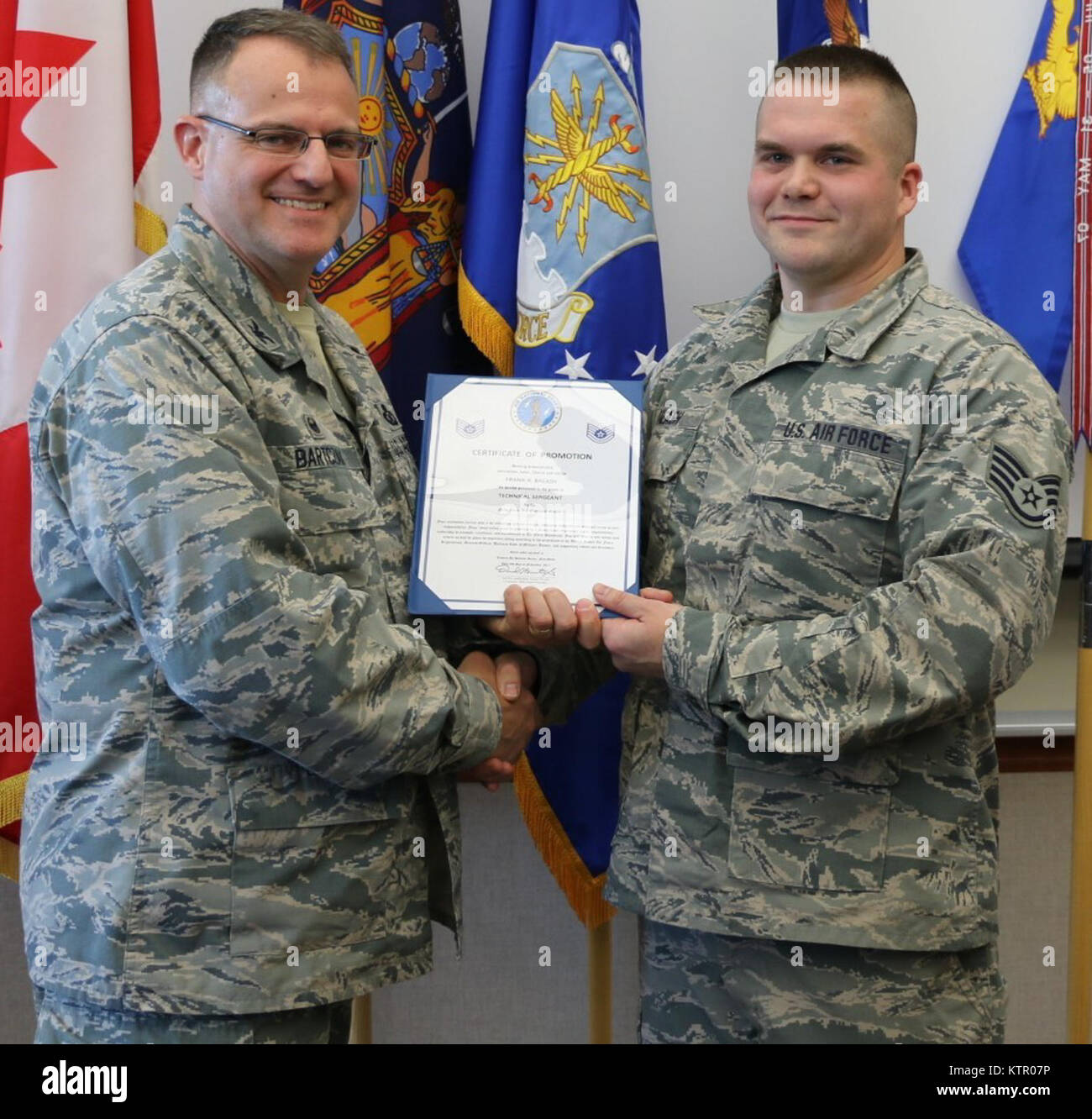 Tech. Sgt. Frank Balash, right, is promoted by Col. David Bartczak ...
