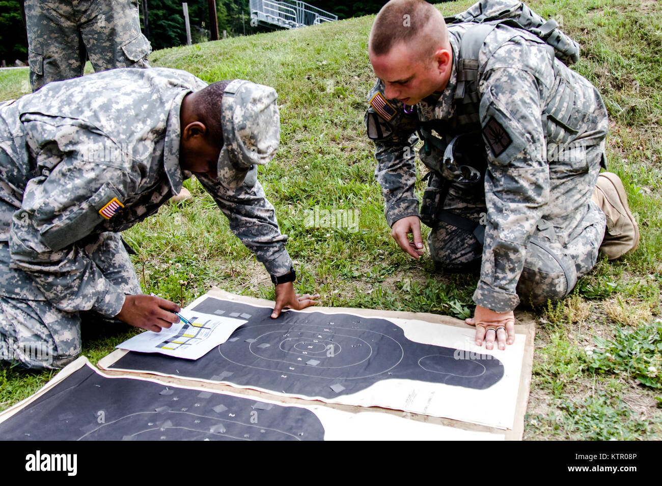 New York Army National Guard Spc. Kenrick Isaac (left), the range ...