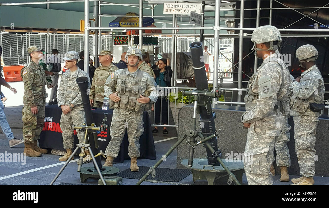Members of the 1st Battalion 69th Infantry speak with members of the ...