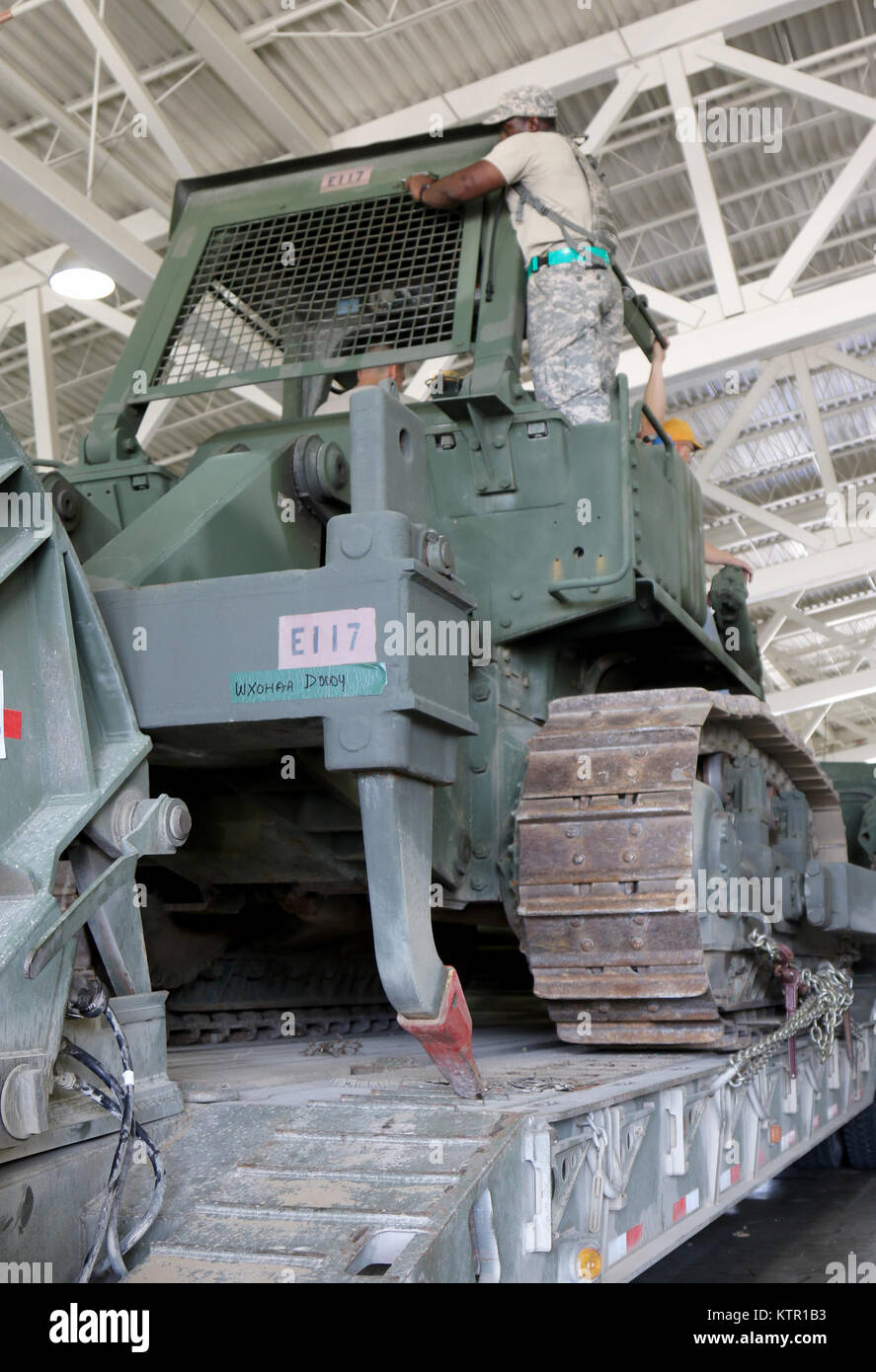 A 27th Infantry Brigade Combat Team Soldier attaches the Multiple ...