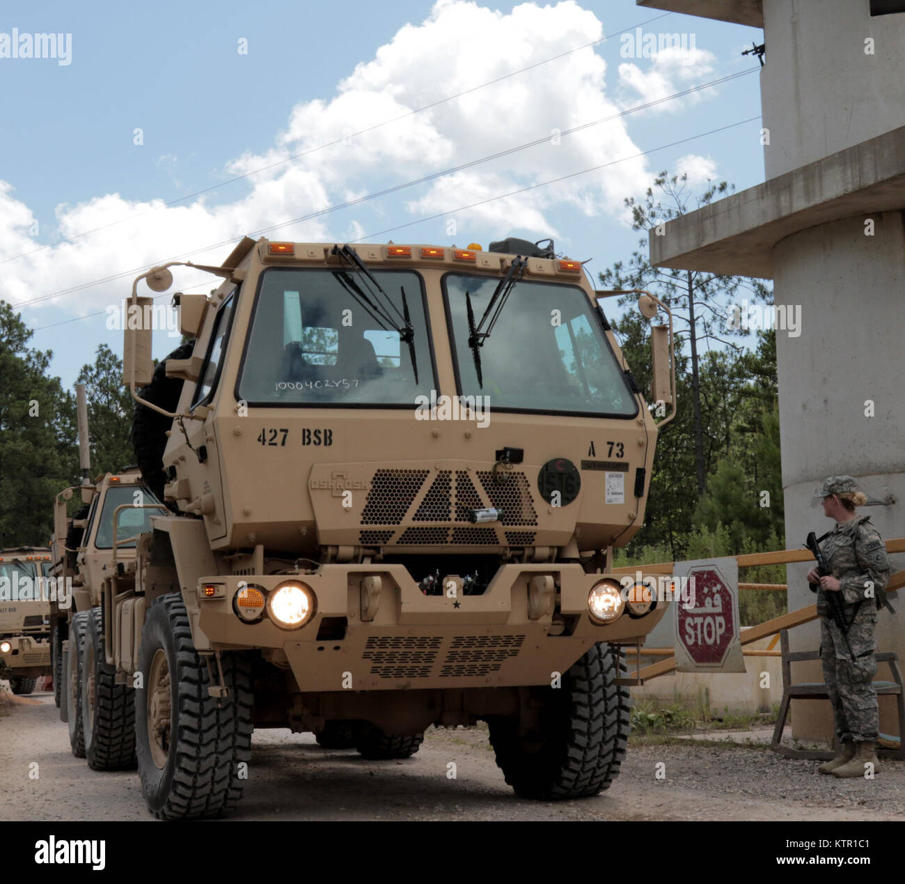 A Soldier waits for the next vehicle to show their idenification in ...