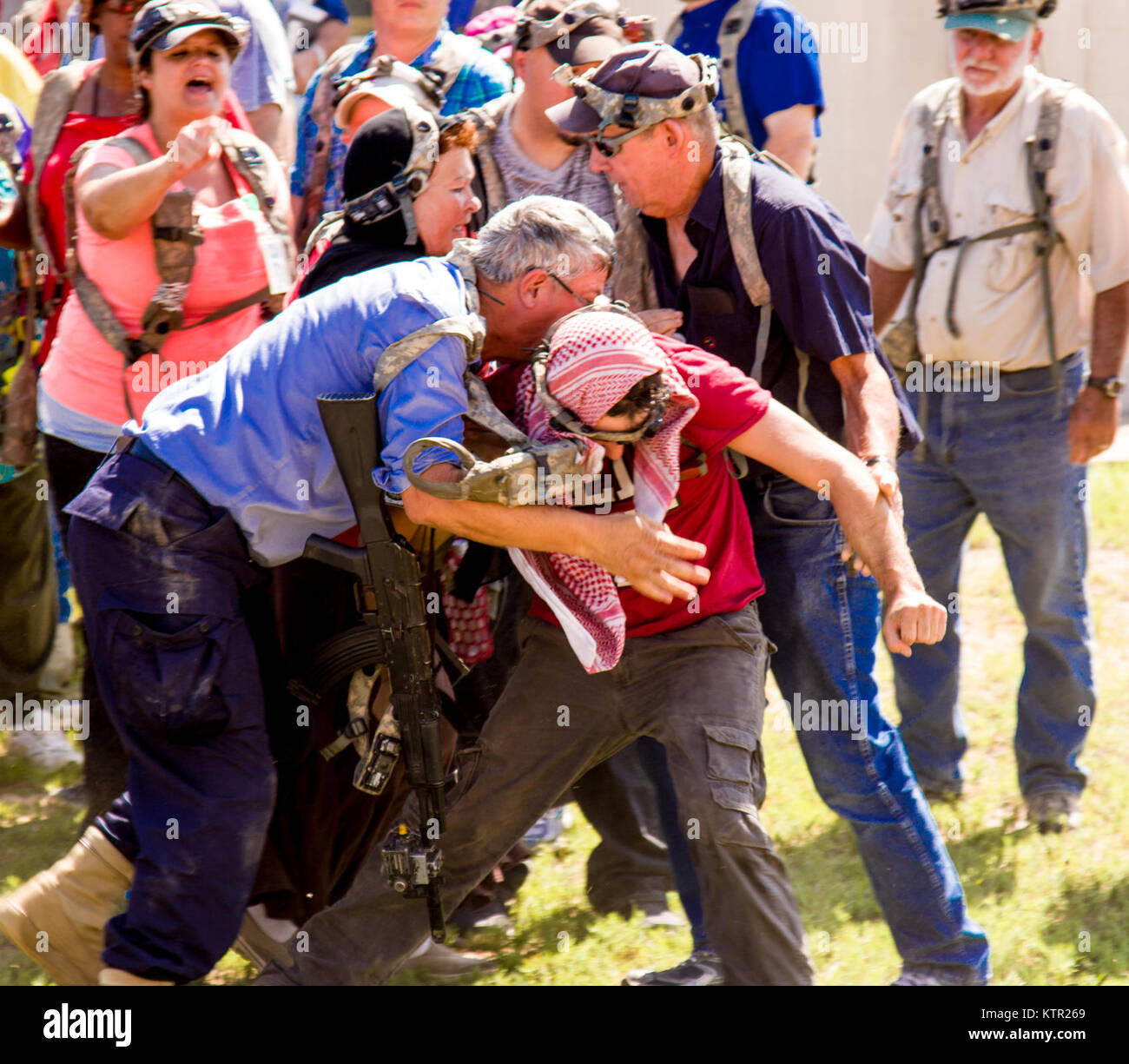 An Atropian police officer attempts to arrest a citizen of Dara Lam ...