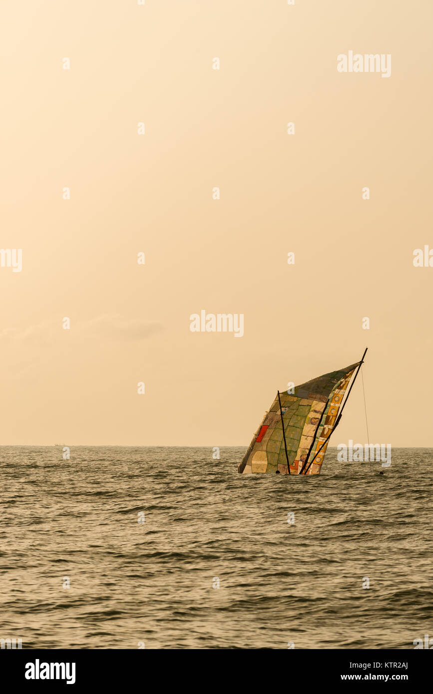Fishermen in an open boat sailing along the Golden Coast, Central ...
