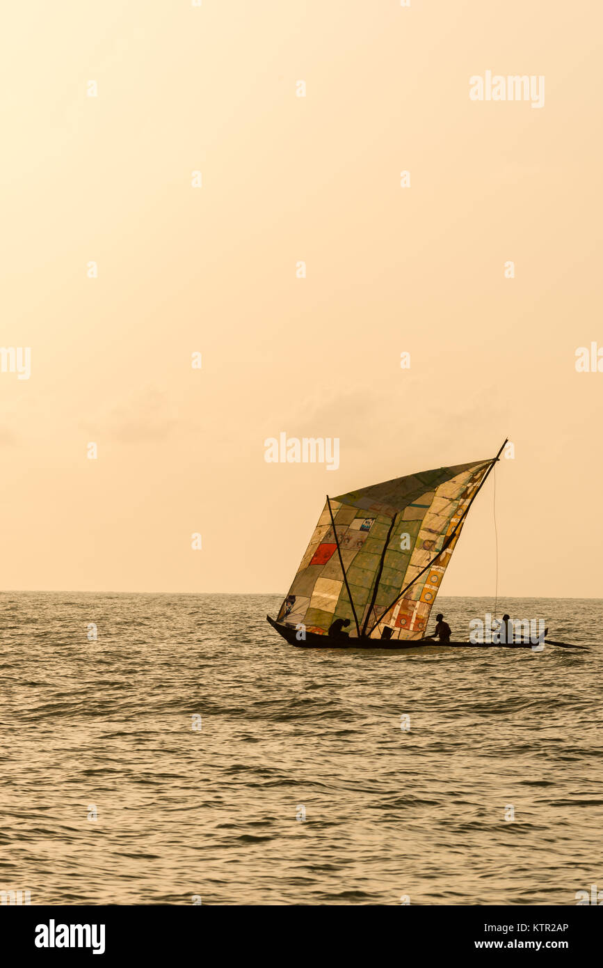 Fishermen in an open boat sailing along the Golden Coast, Central ...