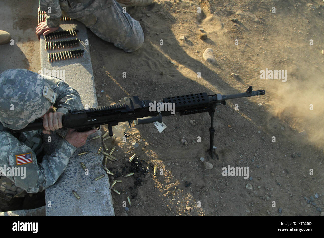 Spc. Kyle Winne of 42nd Infantry Division fires a M240B machine gun at ...