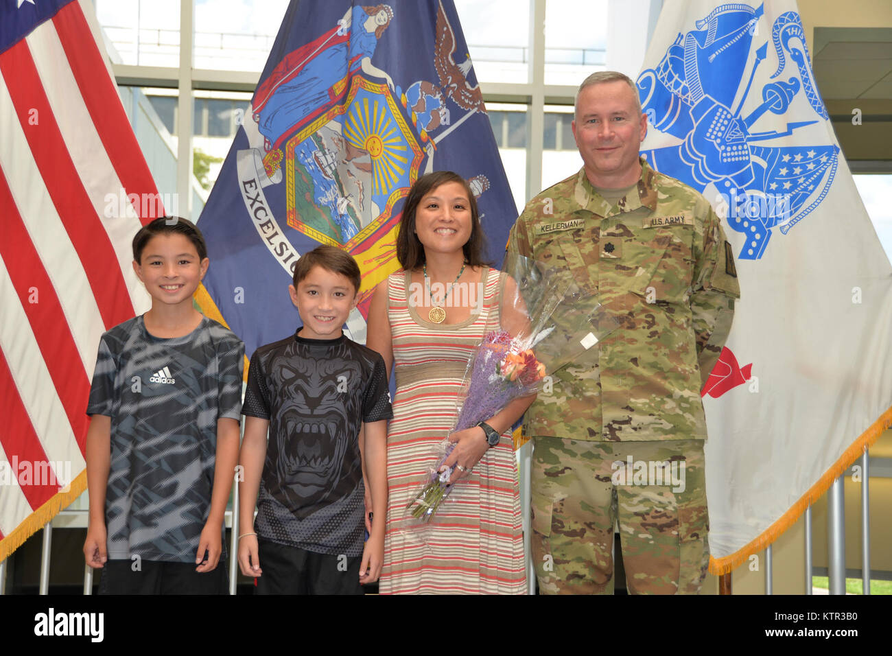 Lt. Col. Chris Kellerman poses with his wife Valerieand his sons Austin ...