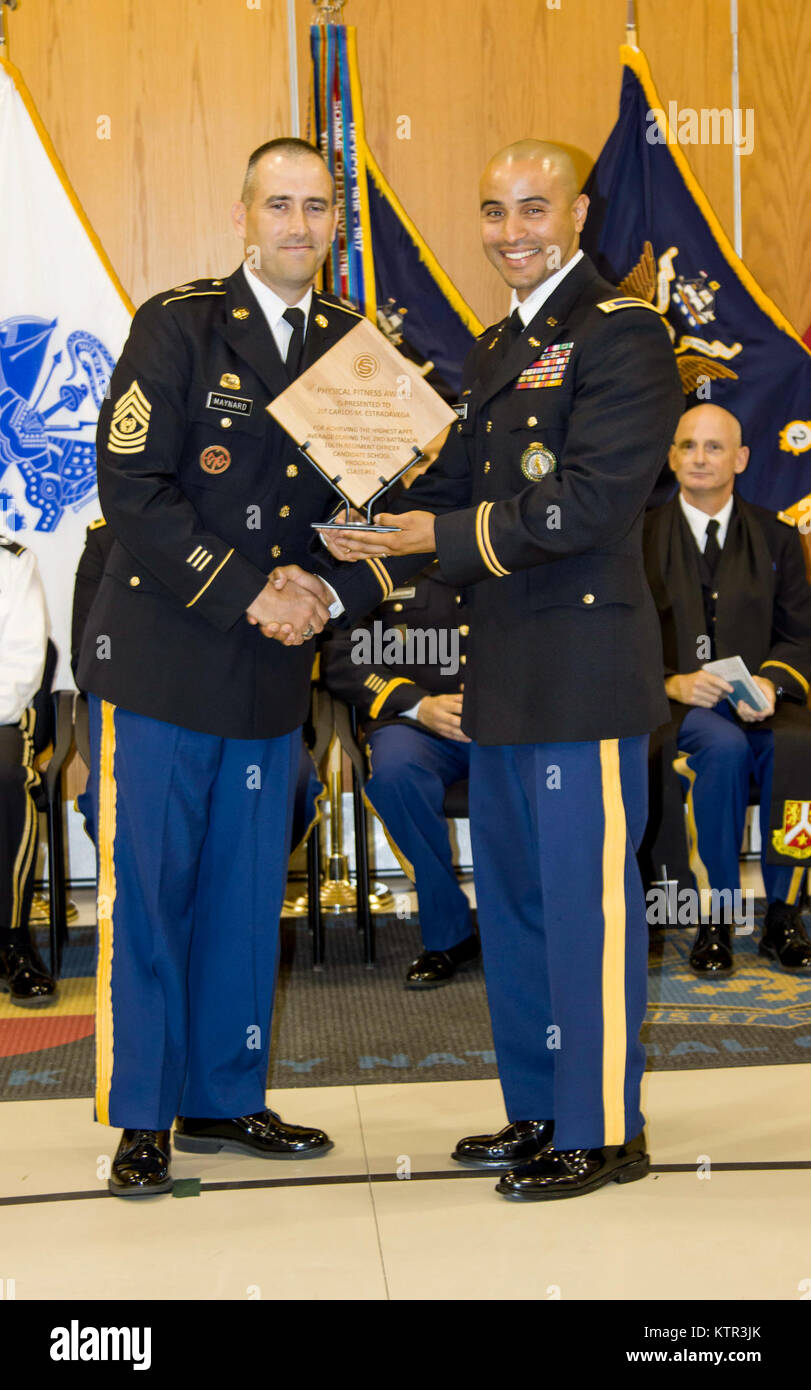 Command Sgt. Maj. Maynard presents 2nd Lt. Carlos N. Estradavega, a ...