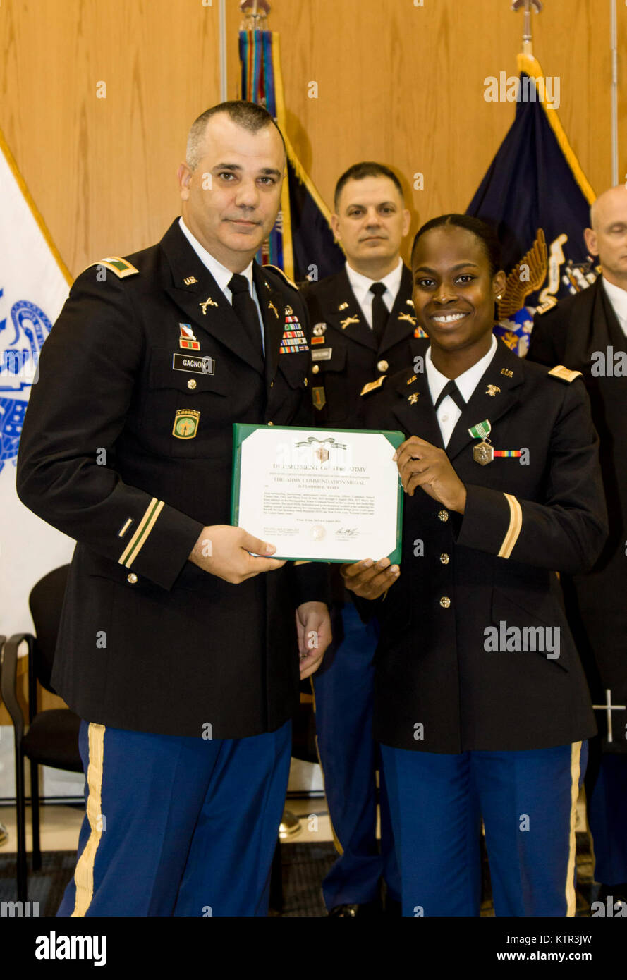 Col. David Gagnon presents 2nd Lt. Lasheri E. Mayes, a newly ...