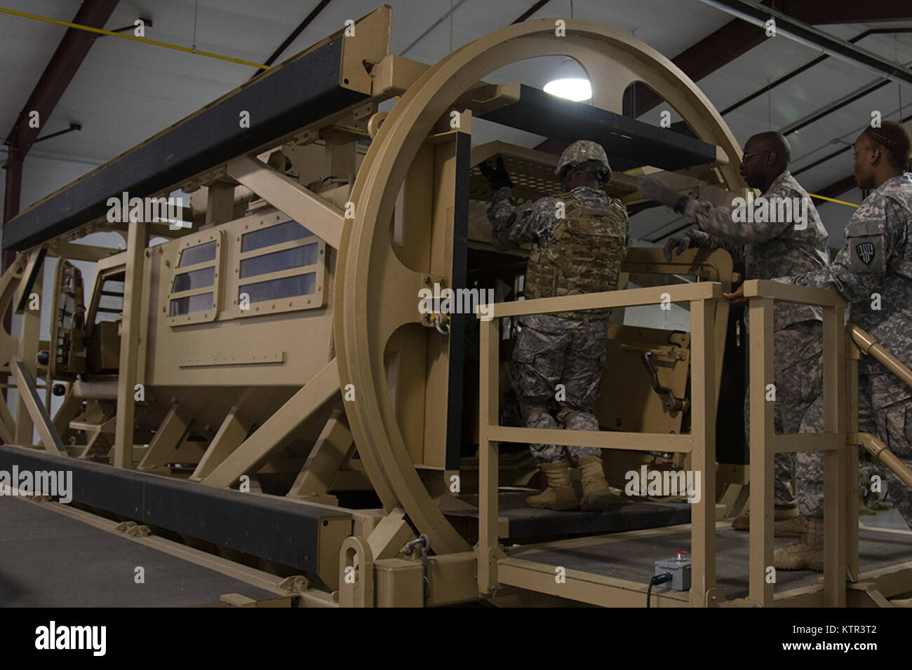 Soldiers of the 369th Sustainment Brigade train on an MRAP Egress ...