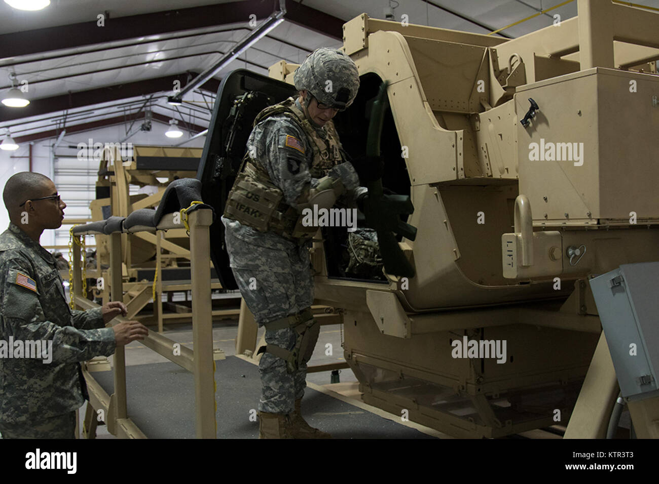 Master Sgt. Deborah Hollinger exits a HMMWV Egress Assistance Trainer ...