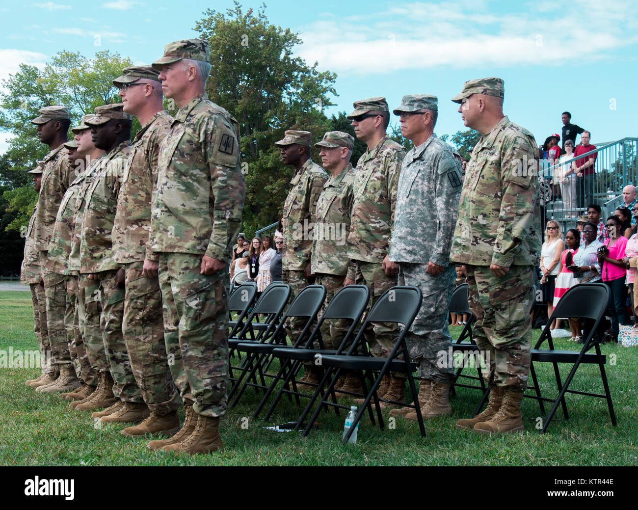 Members of the official party stand at attention during the 369th’s ...