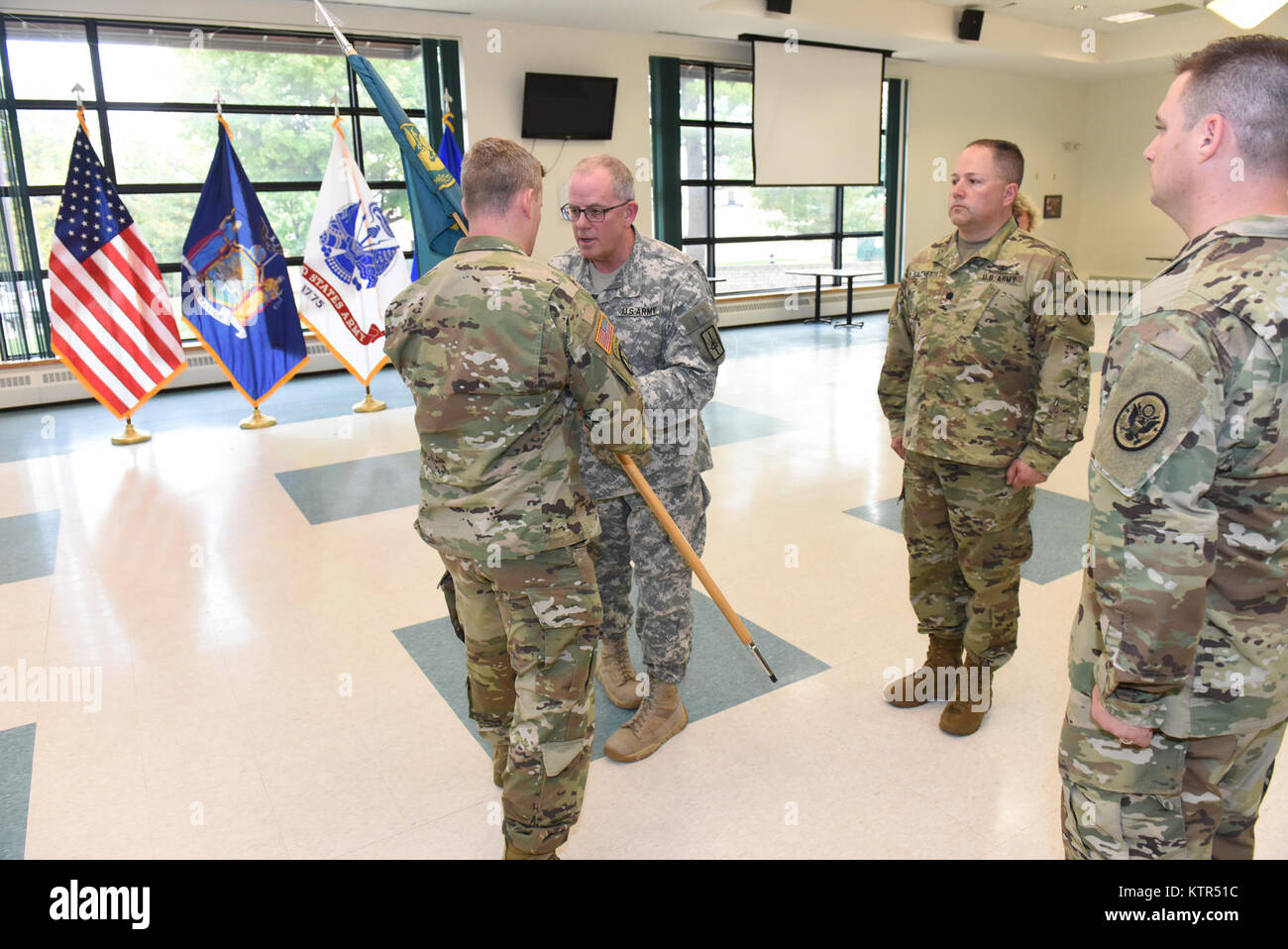 New York Army National Guard Lt. Col. Drew Pinckney passes the guidon ...