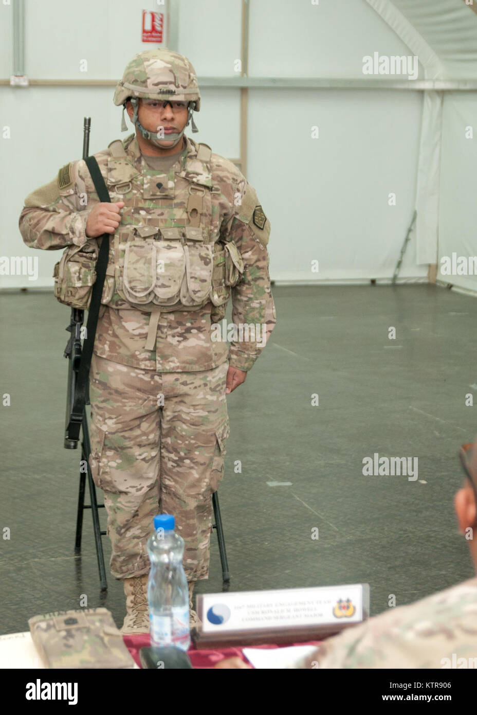 Spc. Jose Tejada, 313th Movement Control Battalion, reports to the ...