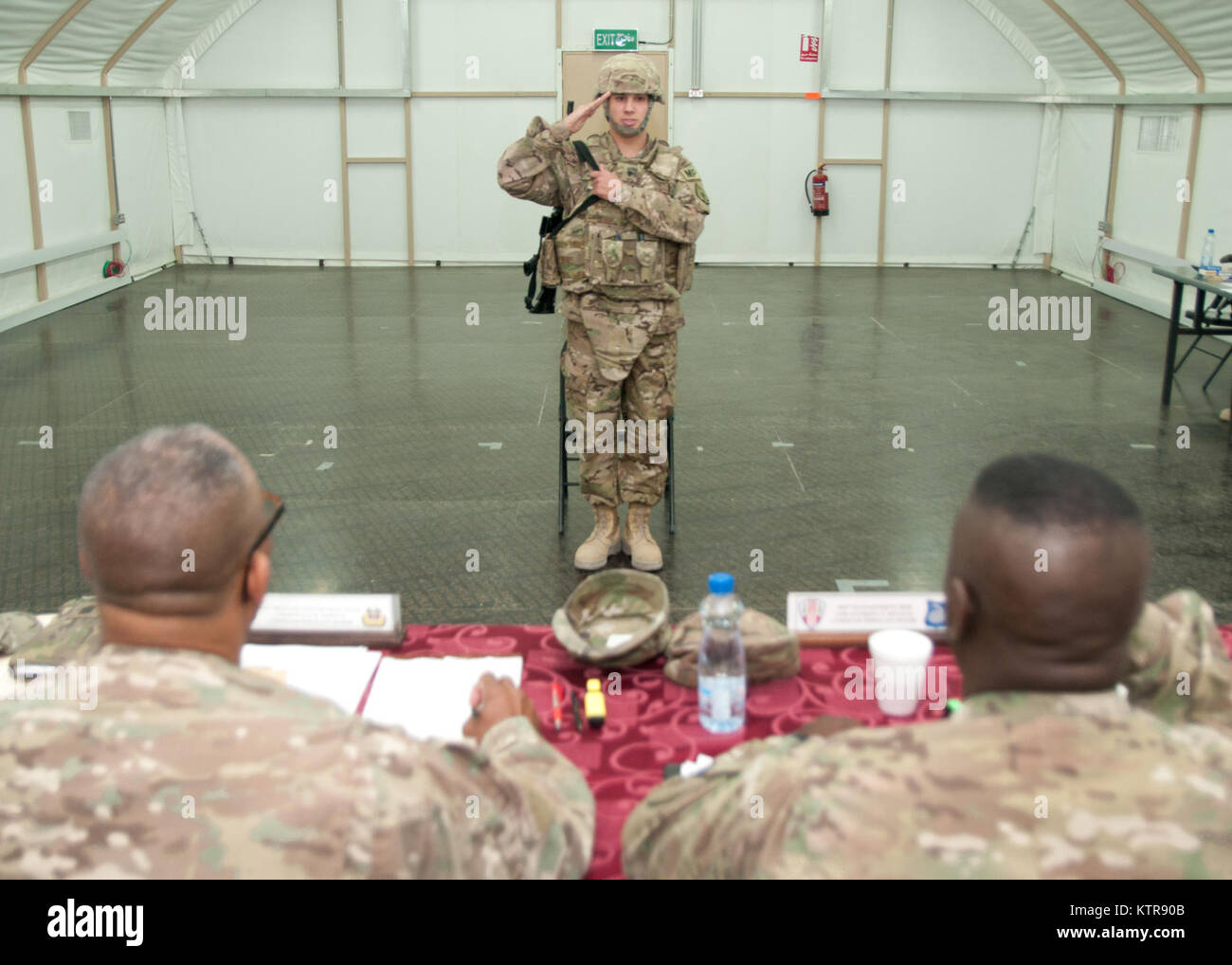 Spc. David Fair, 485th Military Police Company, reports to the 369th ...