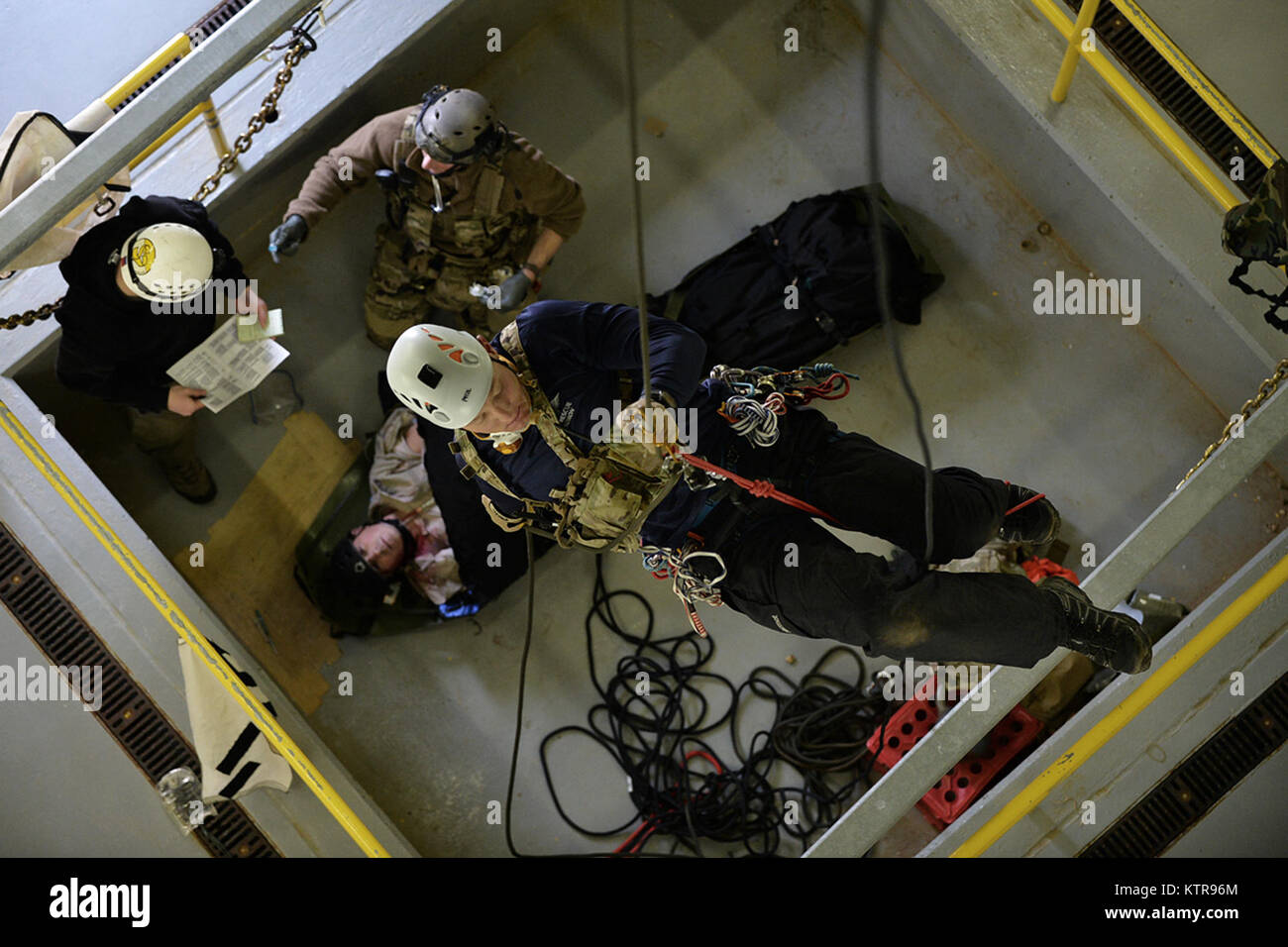 Pararescuemen from the 103rd Rescue Squadron conduct confinsed space ...