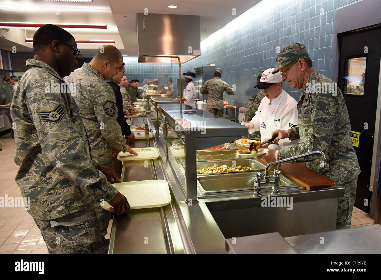 Col. Howard Wagner, Commander, 105th Airlift Wing, serves lunch at ...