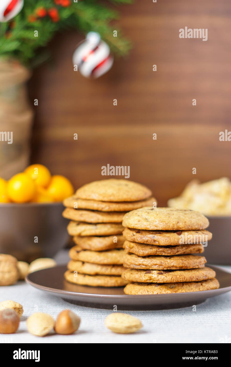 freshly baked chocolate chip cookies on a table with blurred background ...