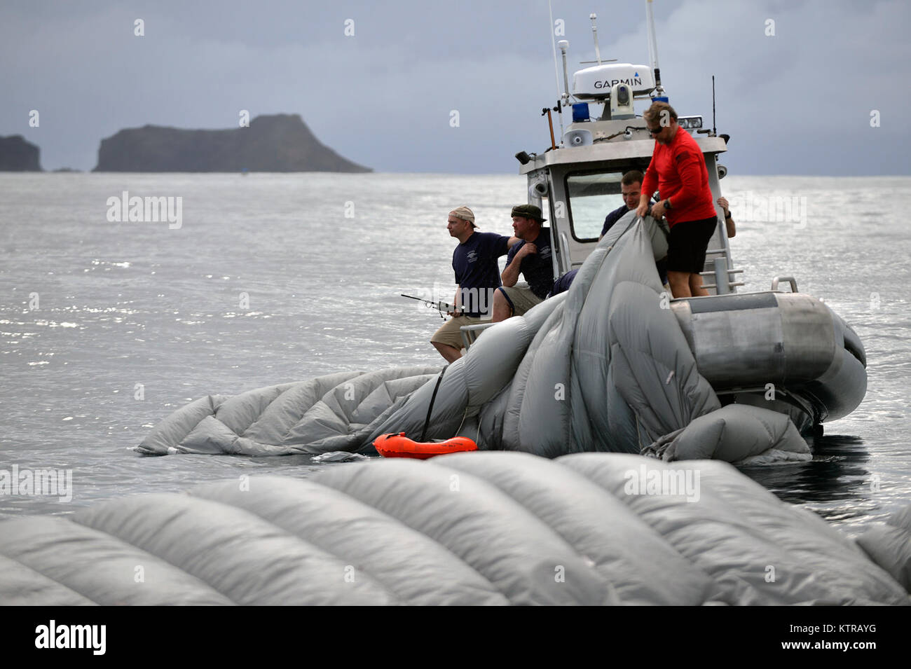 The "Front Porch" flotation device is unfolded and inflated by ...