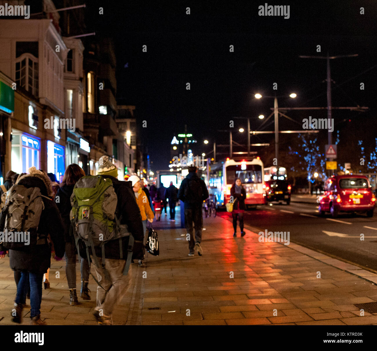 People walking on night streets Stock Photo - Alamy