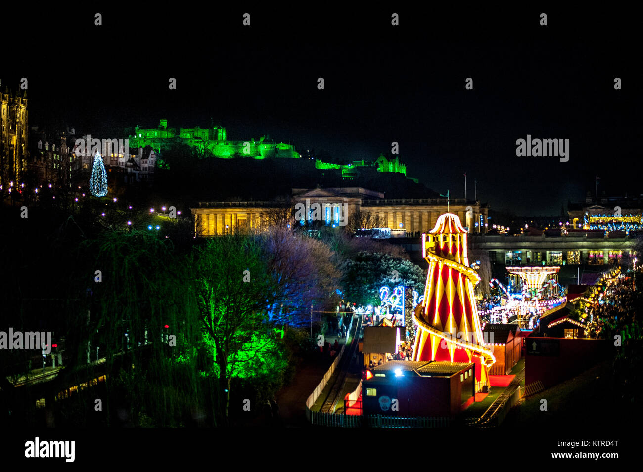 Night lights of festive attractions in Princess gardens in Edinburgh ...