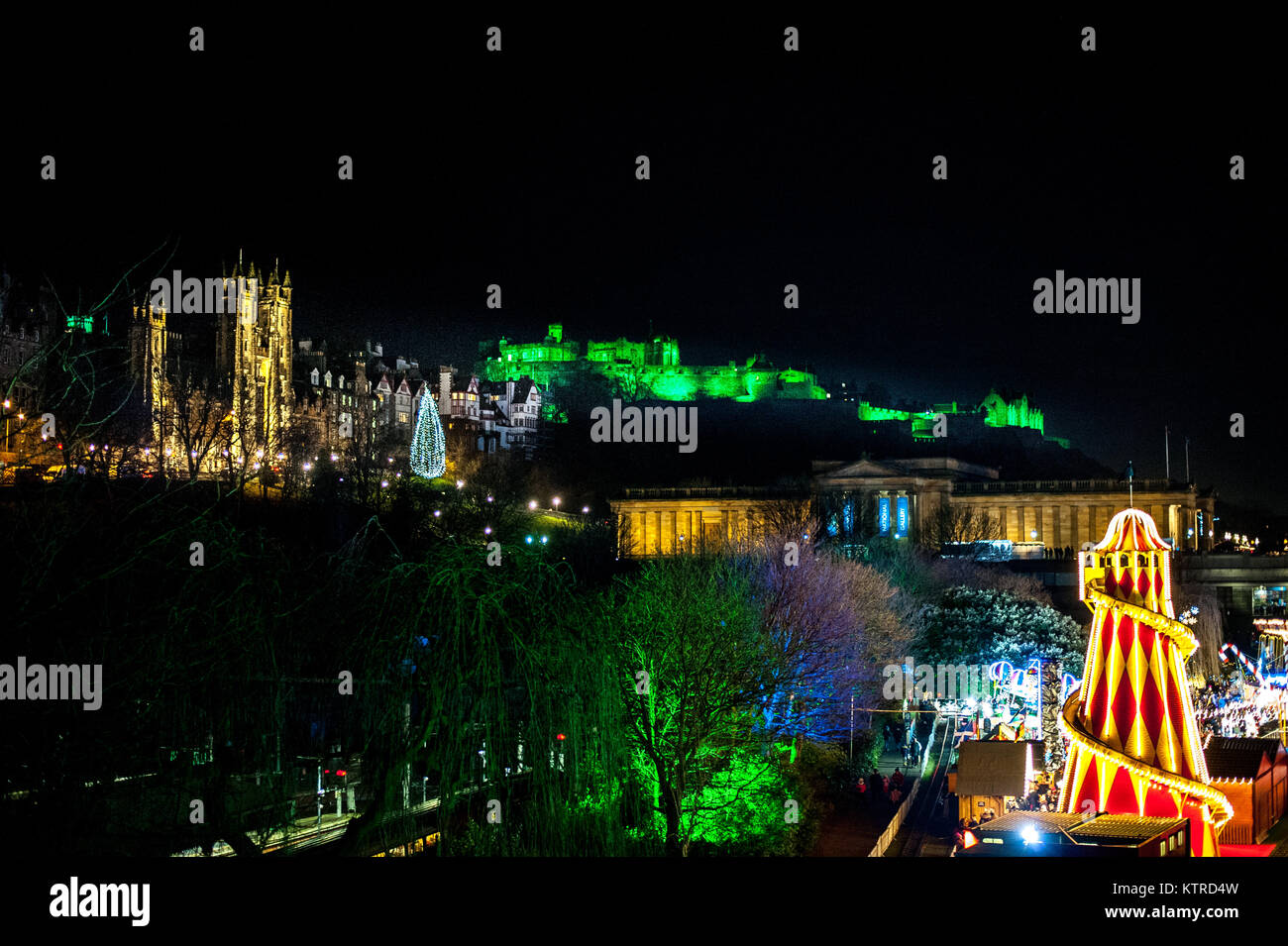 Night lights of festive attractions in Princess gardens in Edinburgh ...