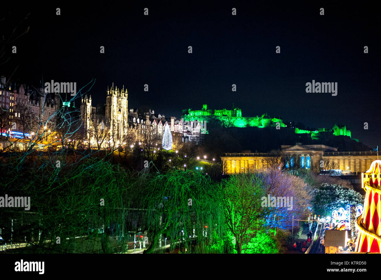 Night lights of festive attractions in Princess gardens in Edinburgh ...