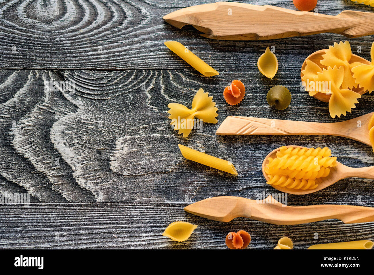Various mix of pasta on wooden rustic background Stock Photo - Alamy
