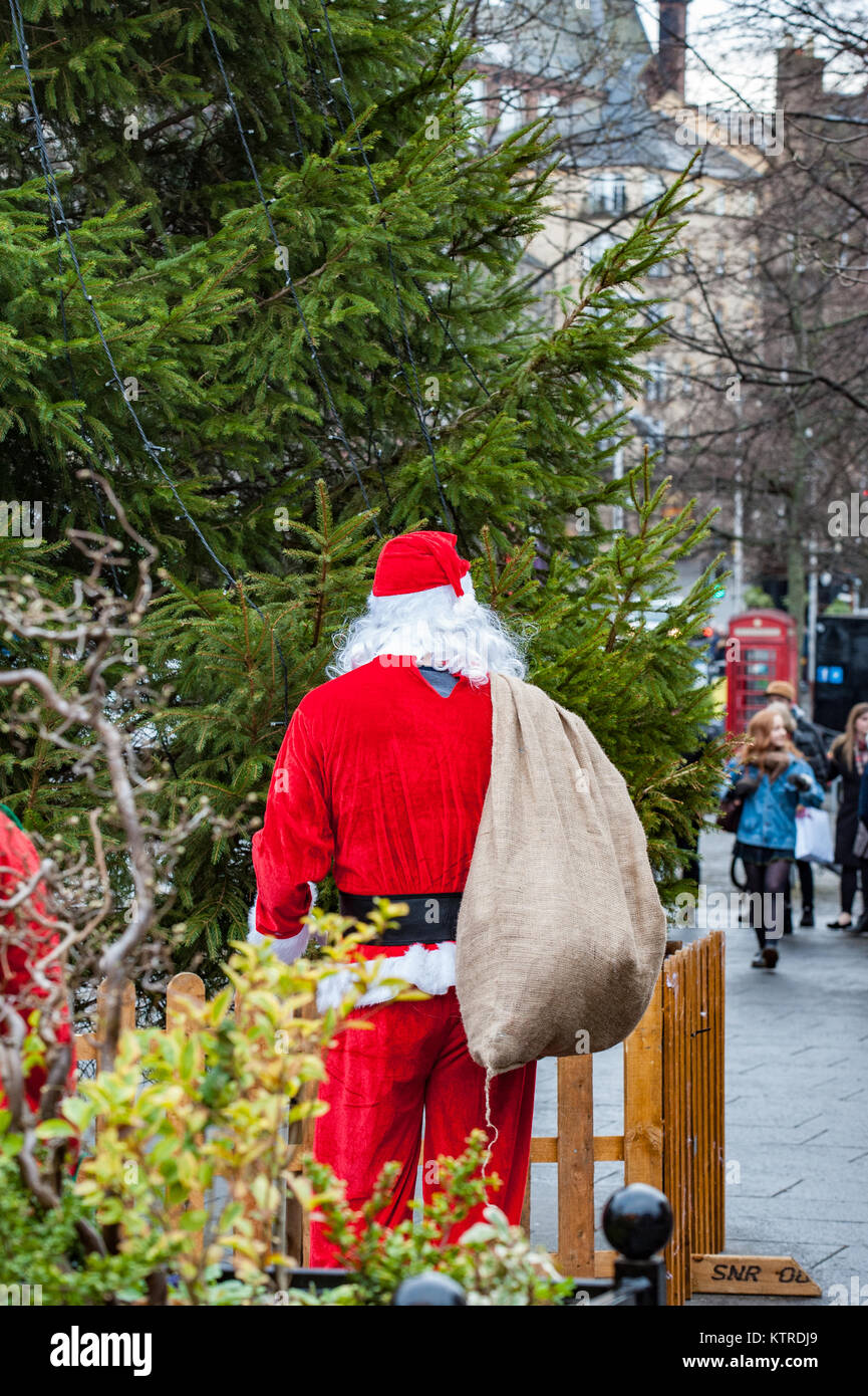 A man dressed as Santa on christmas market Stock Photo - Alamy