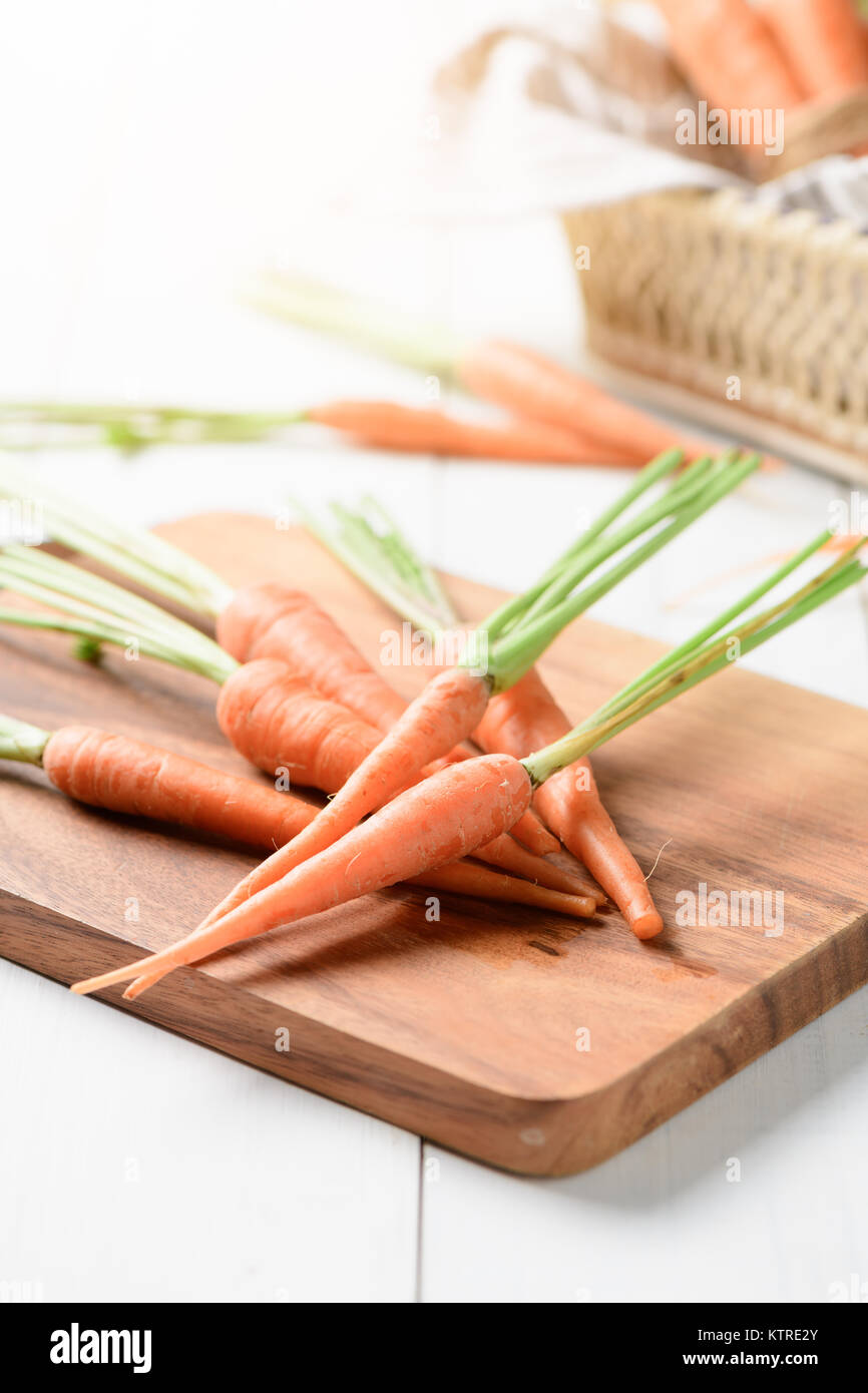 fresh carrot, baby carrot on wood block on white wood background, This ...