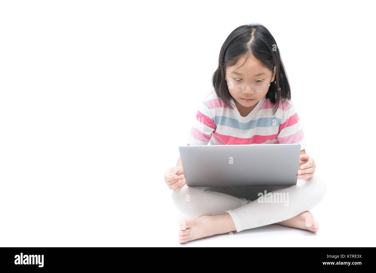 asian cute girl student using laptop to do homework isolated on white ...