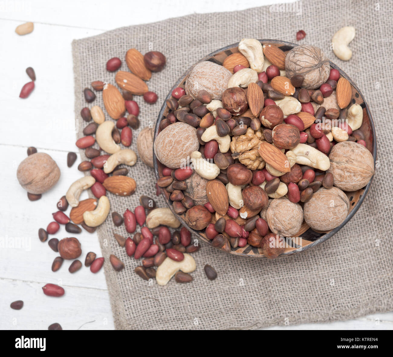 Assorted nuts in a wooden bowl Stock Photo - Alamy