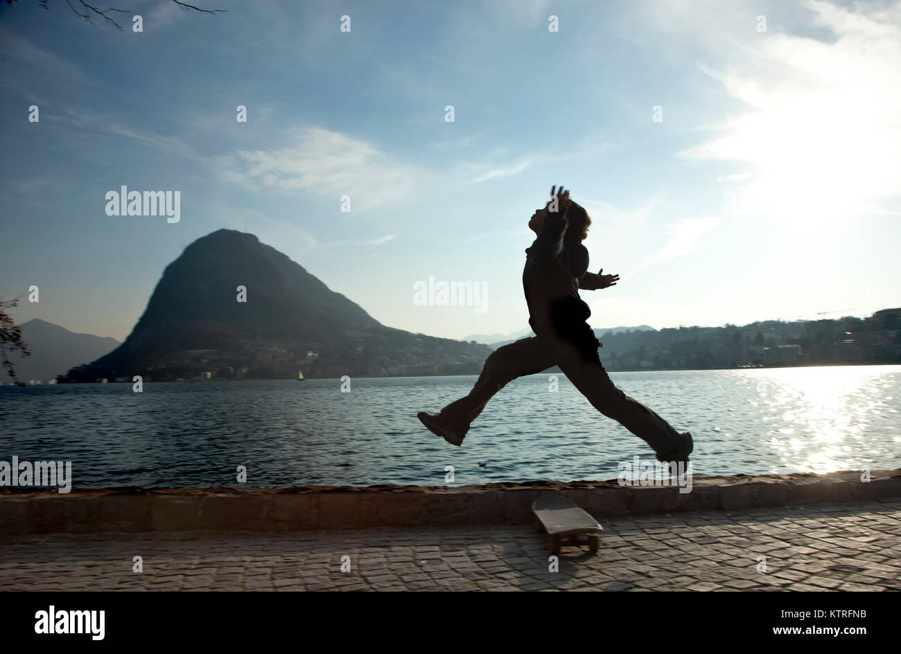 children running near a lake Stock Photo - Alamy
