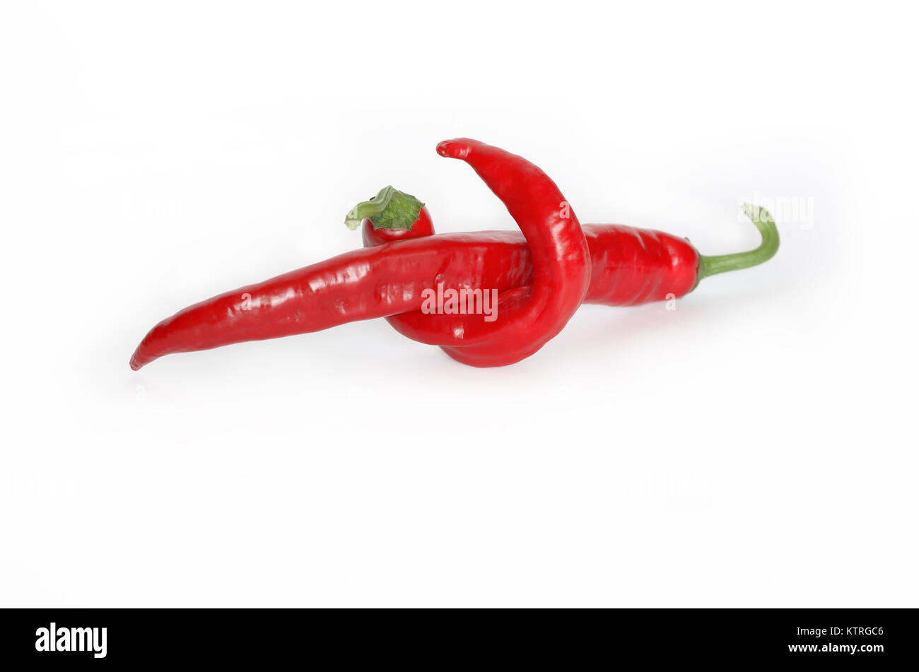 Two red chili peppers isolated on white background. Clipping path is ...