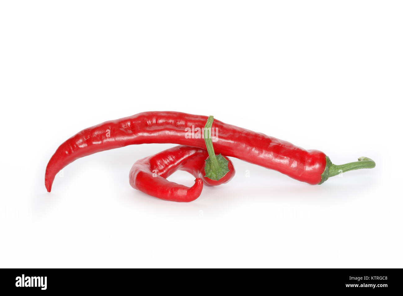 Two red chili peppers isolated on white background. Clipping path is ...