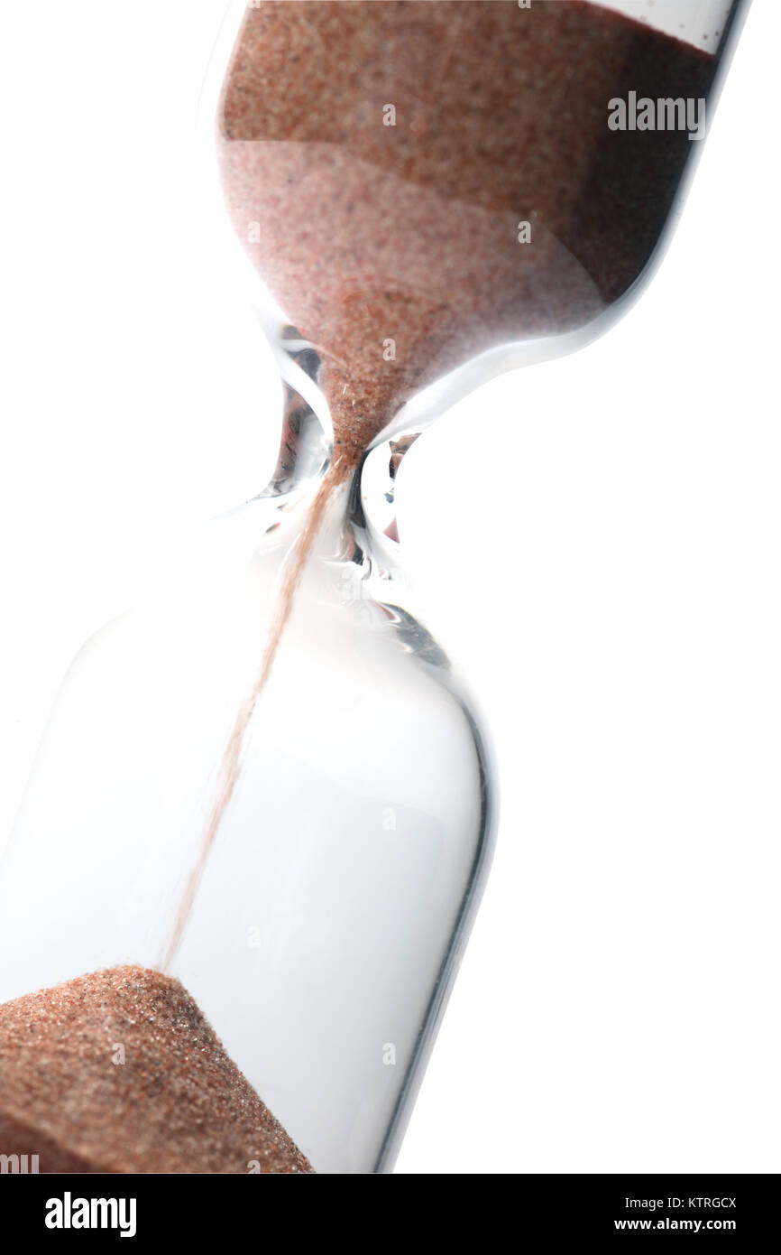 Extreme closeup of hourglass isolated on white background Stock Photo ...