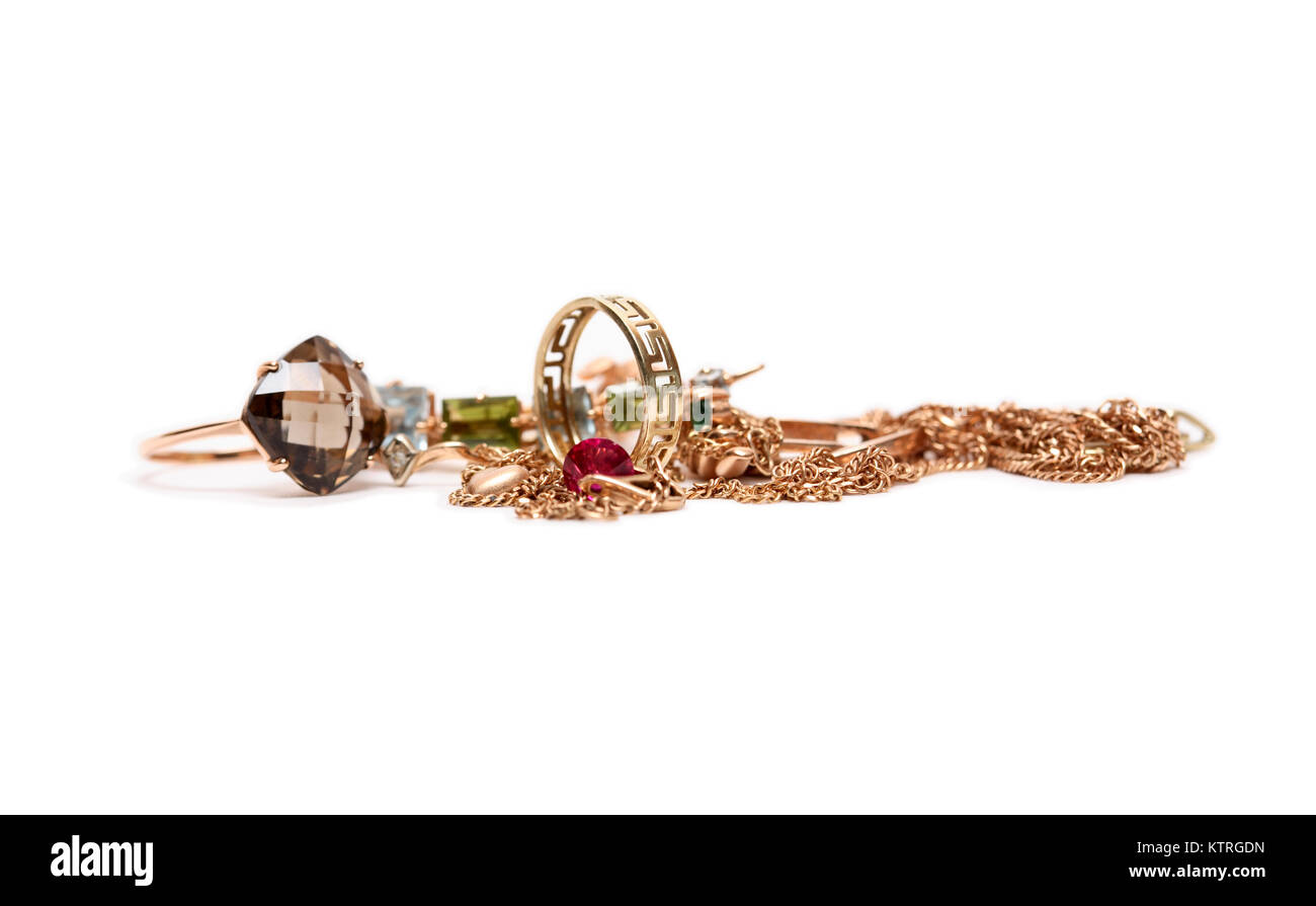 Pile of gold jewelry isolated on white background Stock Photo - Alamy