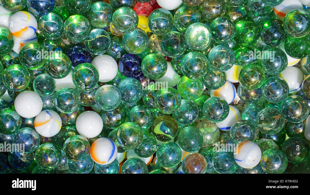 Big bunch of used glass marbles Stock Photo - Alamy