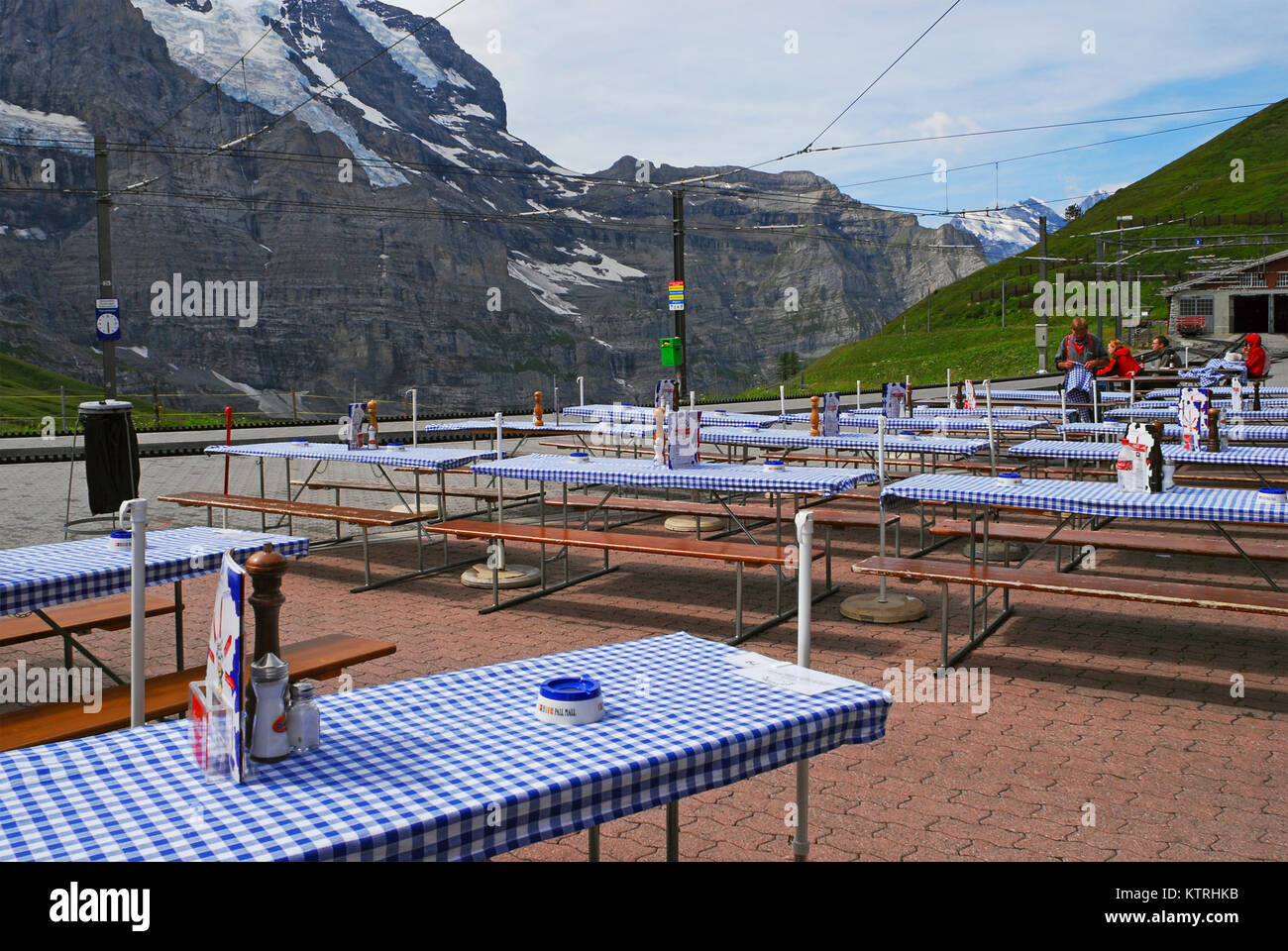 outdoor restaurant tables in Kleine Scheidegg, in the Bernese Oberland ...