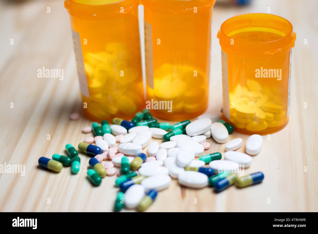 assortment of pharmaceutical drugs with pill bottles in the background ...